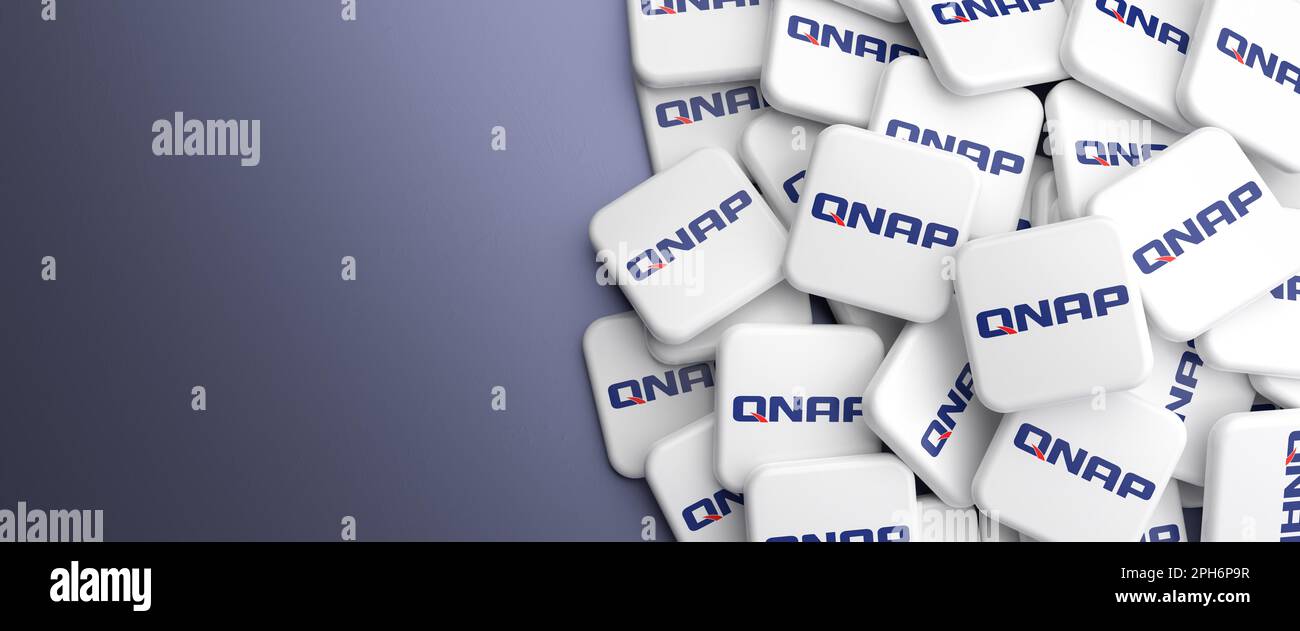 Logos Of The Nas Manufacturer Qnap On A Heap On A Table Web Banner Format Copy Space Stock