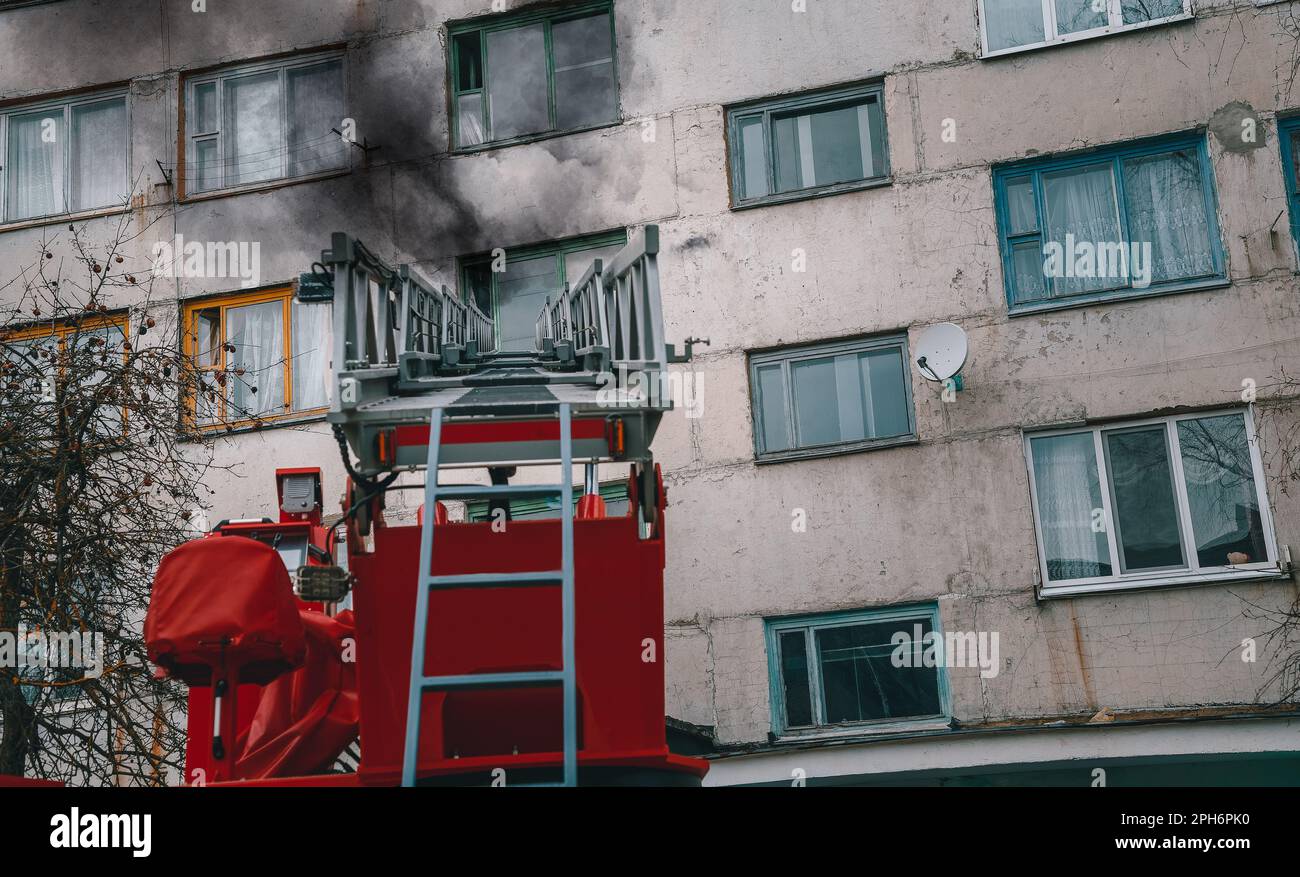 the ladder of the fire engine is extended to the window from which ...