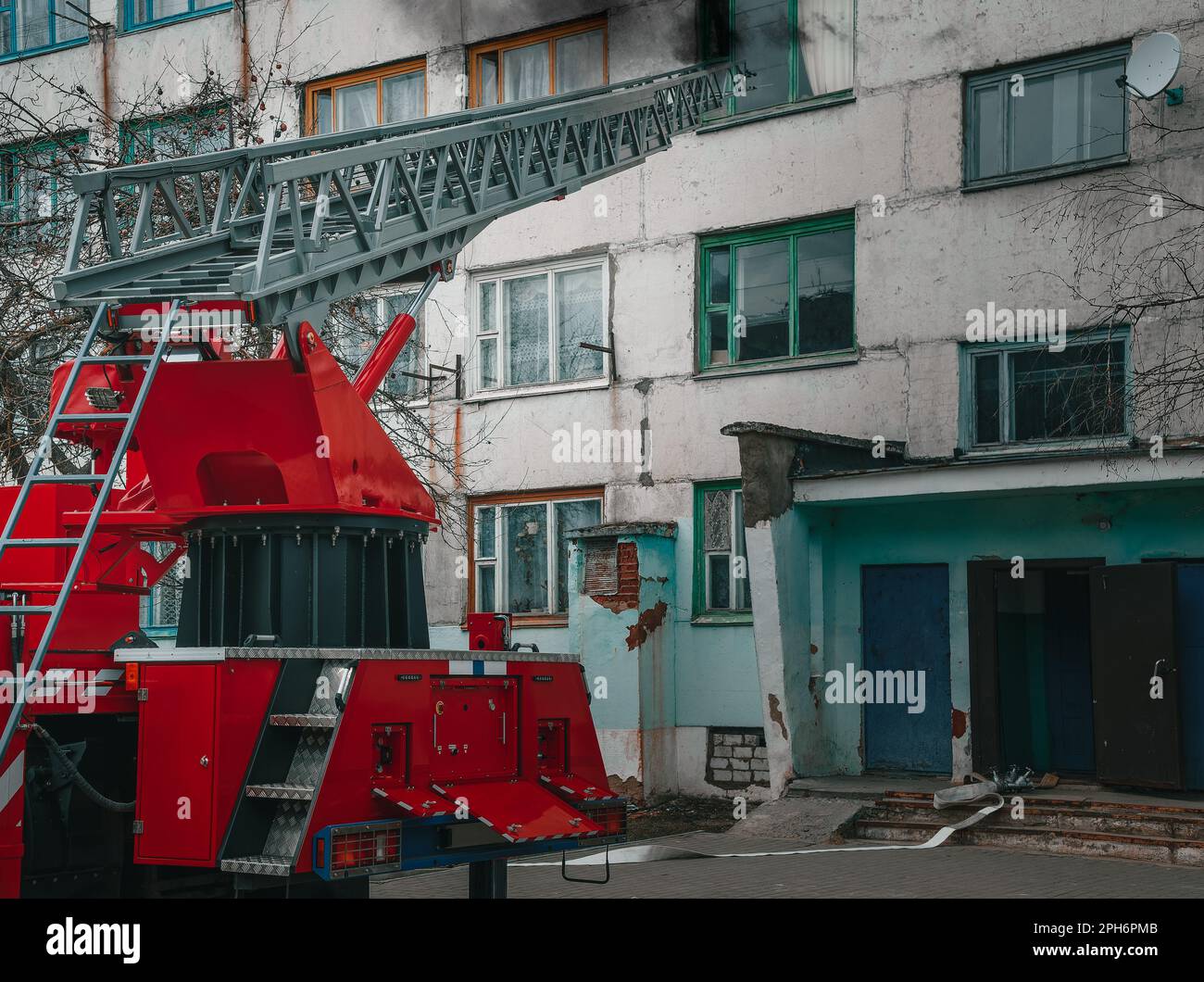 the ladder of the fire engine is extended to the window from which ...