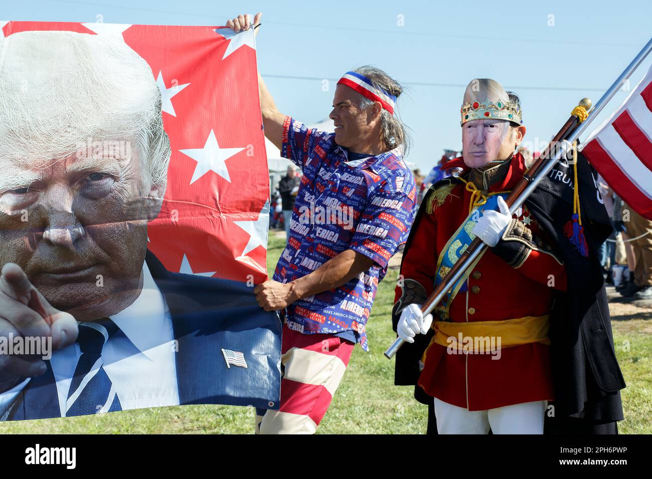 Waco, Texas, USA. 25th Mar, 2023. A Trump supporter tries to stabilize ...