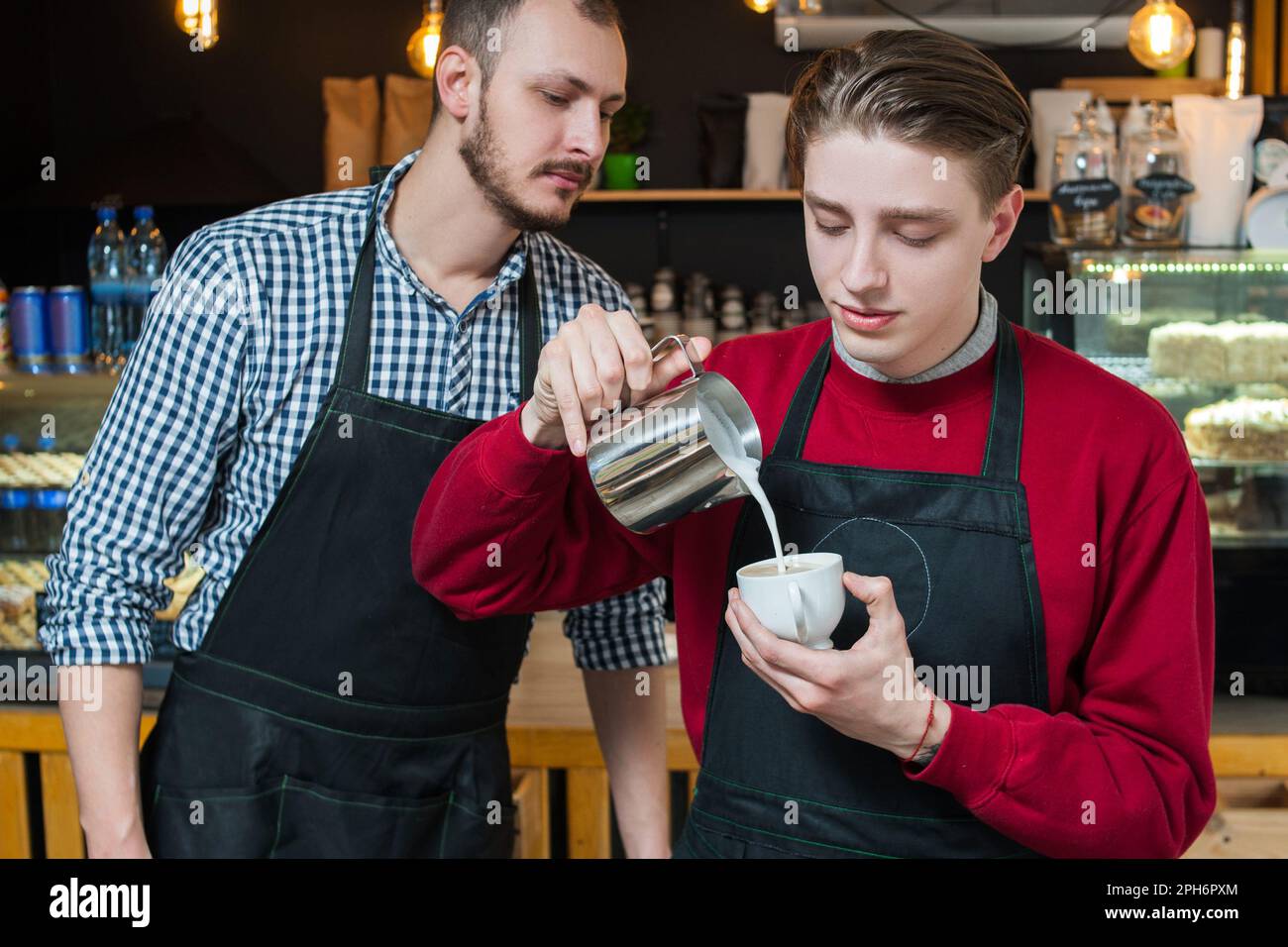 barista course learning profession young man study Stock Photo - Alamy