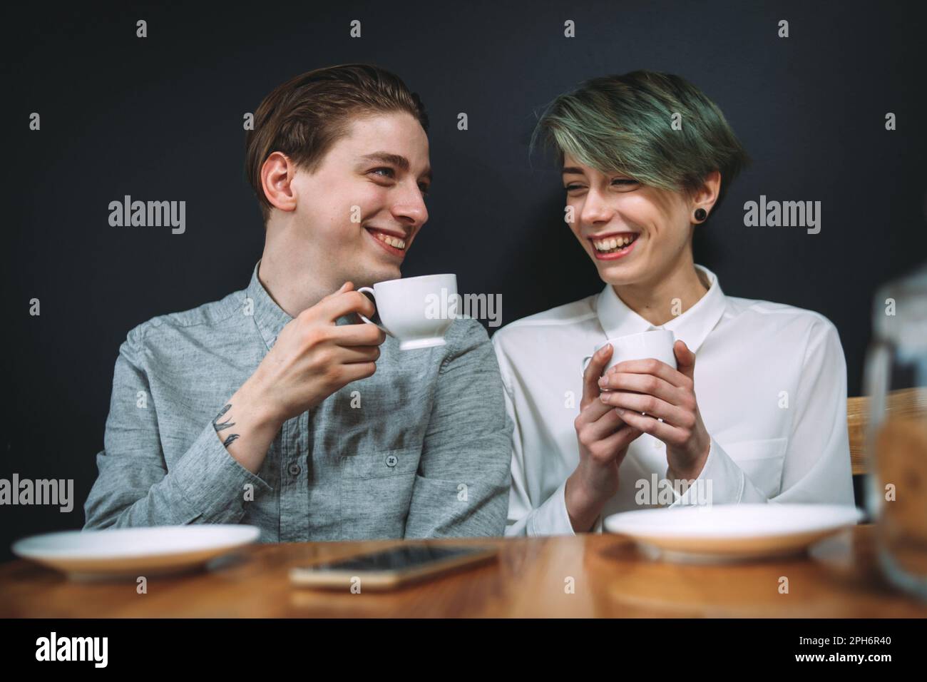 couple relationship drink coffee bar laughing date Stock Photo - Alamy