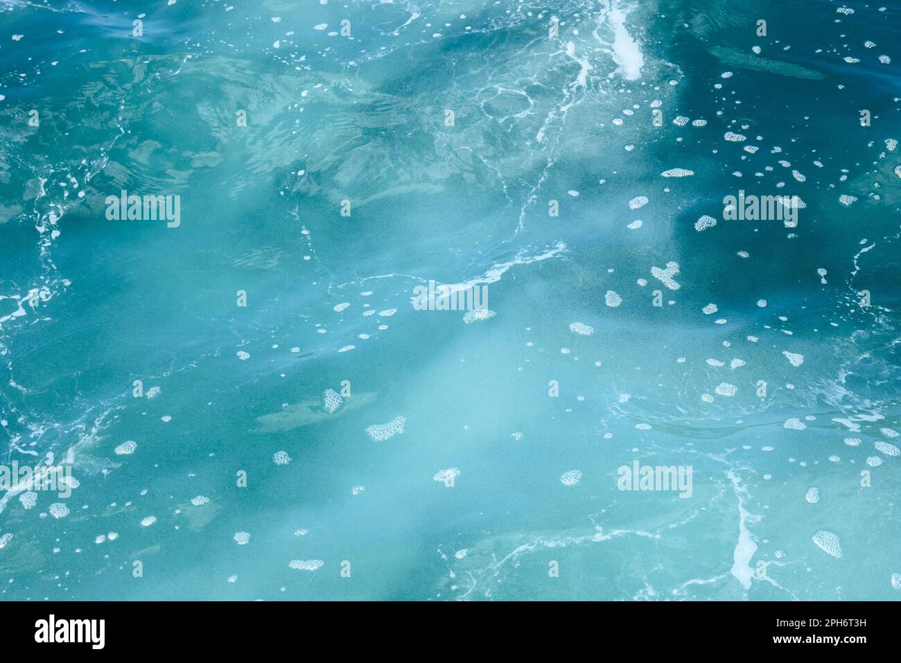 Natural background of blue foaming sea water Stock Photo - Alamy