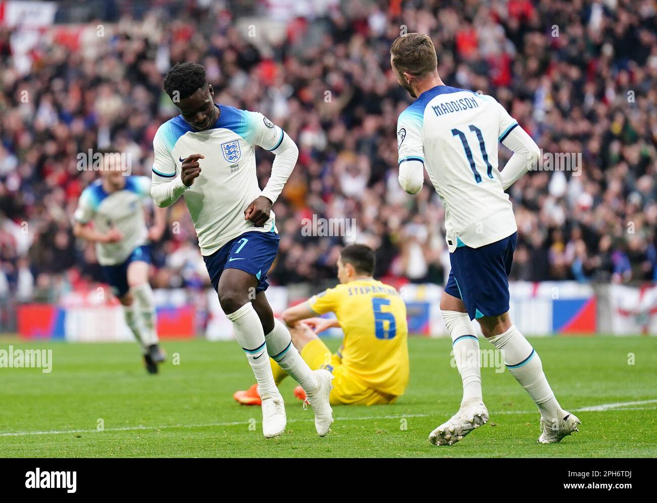 England’s Bukayo Saka celebrates scoring his sides second goal during ...