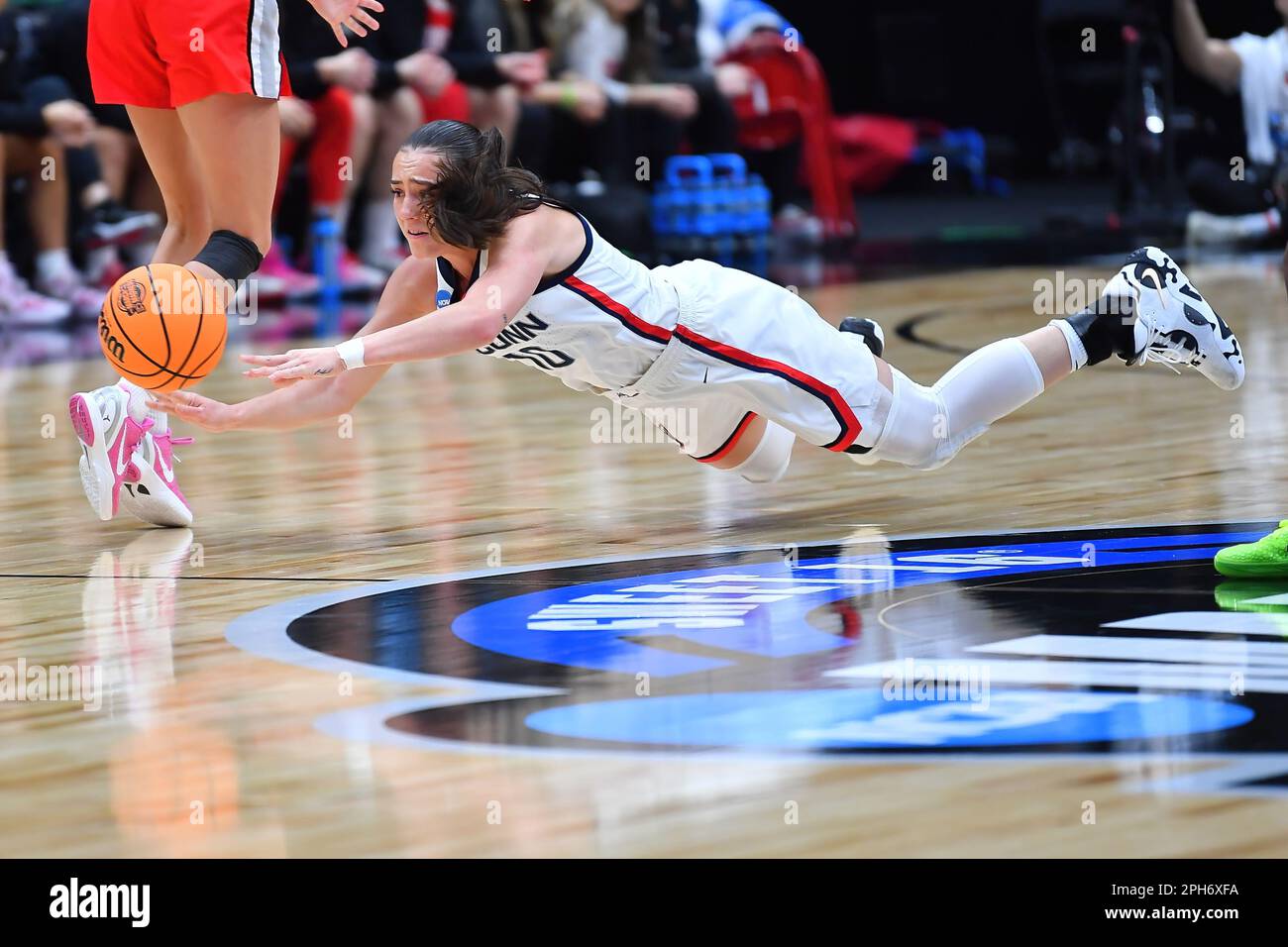 March 25, 2023: UConn Huskies guard Nika Muhl (10) tries to save the ...