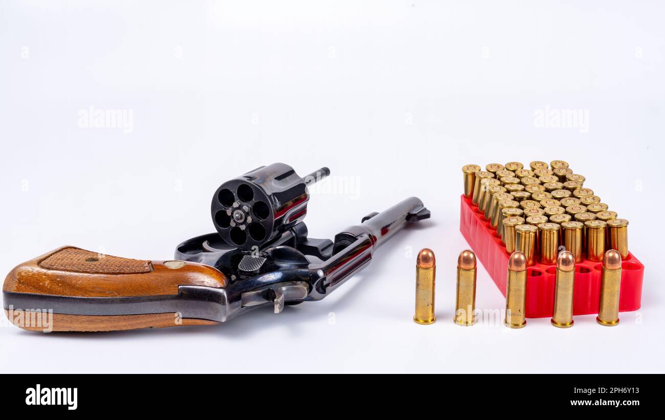 Still life handgun with bullets on display Stock Photo - Alamy