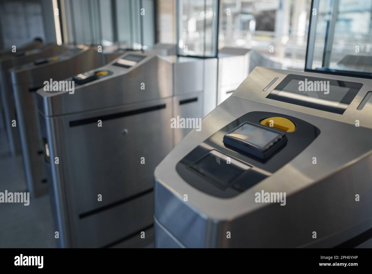Ticket validator gates at train station Stock Photo - Alamy