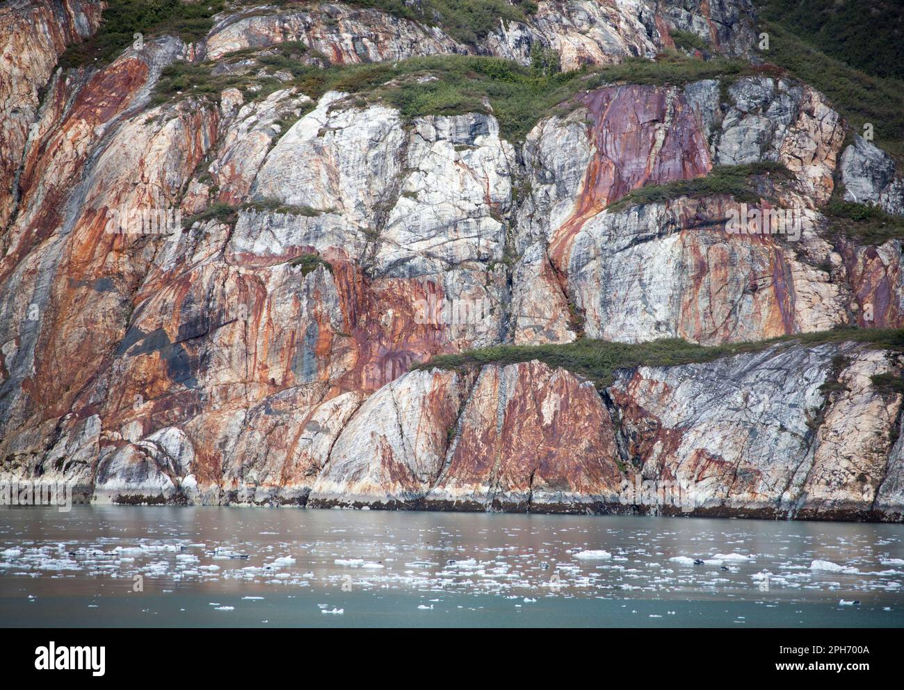 The close view of steep brown color rocks in Glacier Bay national park ...