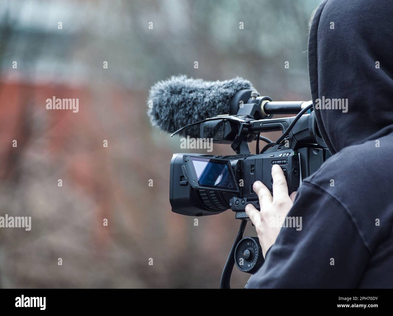 rare view of person with a video camera Stock Photo - Alamy