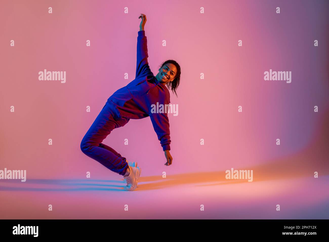 Dancing as hobby. African american female hip-hop dancer expressing ...