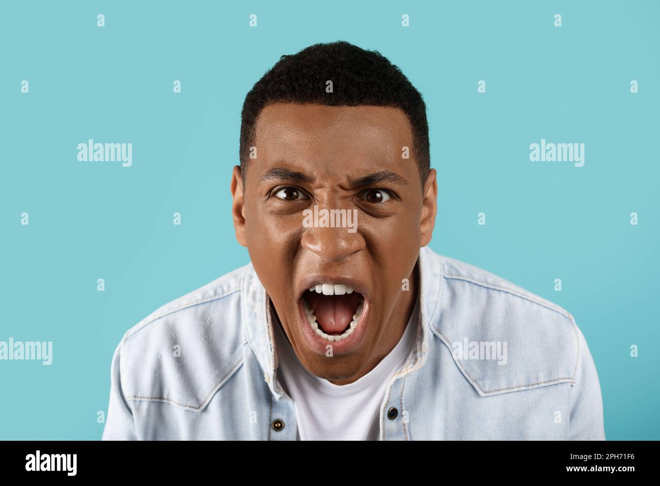 Aggressive angry sad millennial black man freaking out, screaming ...