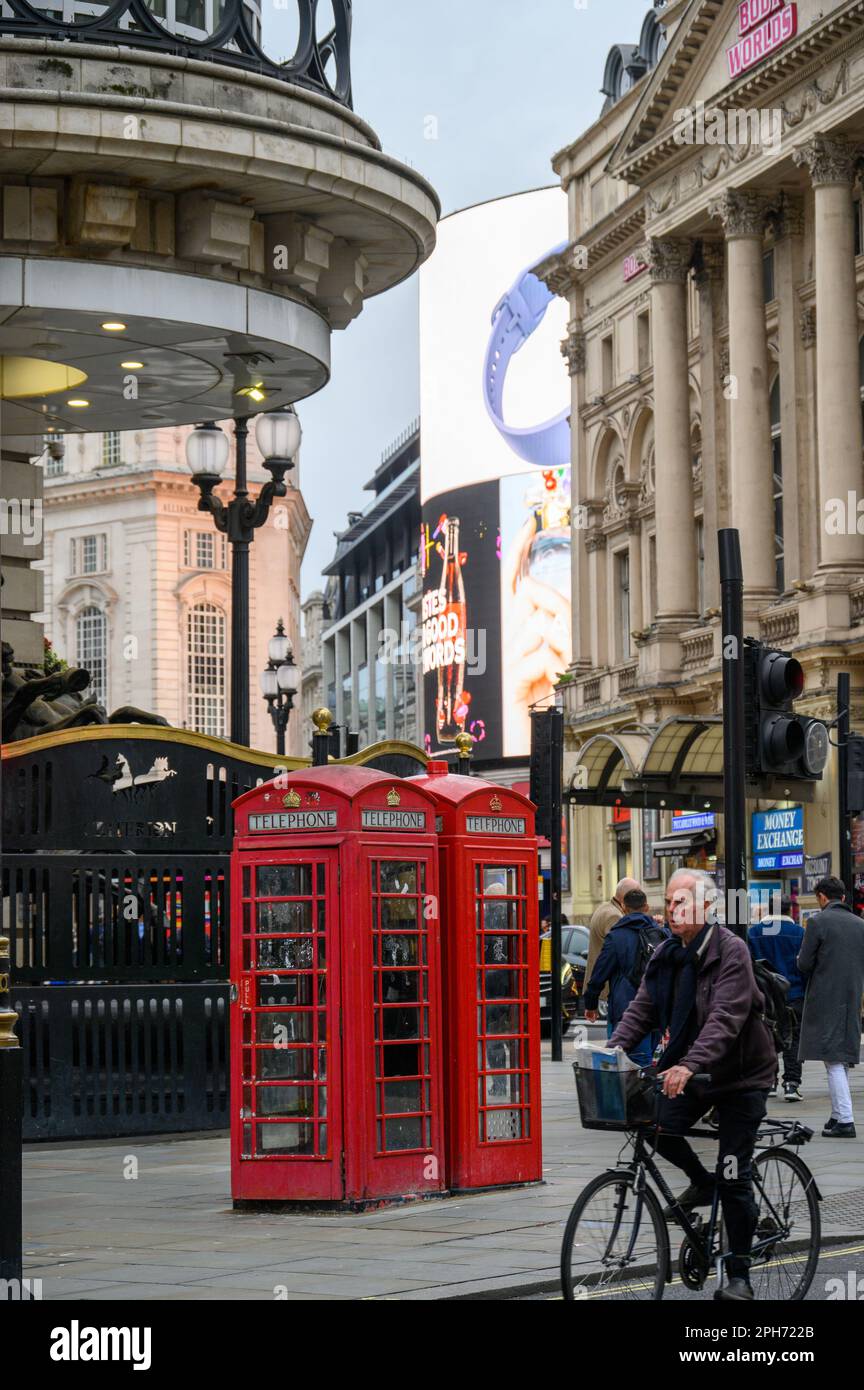 LONDON - November 13, 2022: A man cycles past the traditional red ...