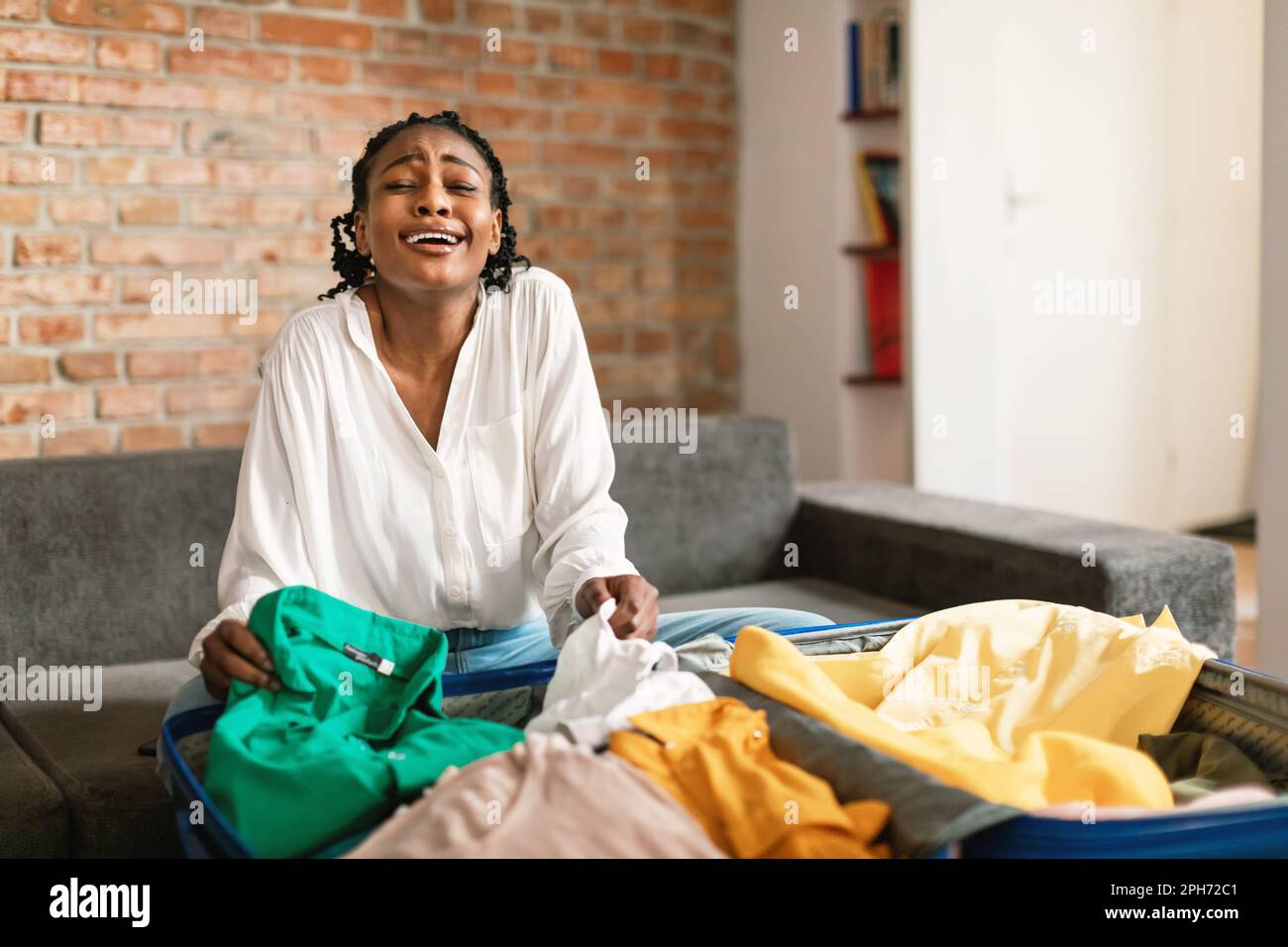 Travel issue. Unhappy black woman crying over canceled flight, visa ...