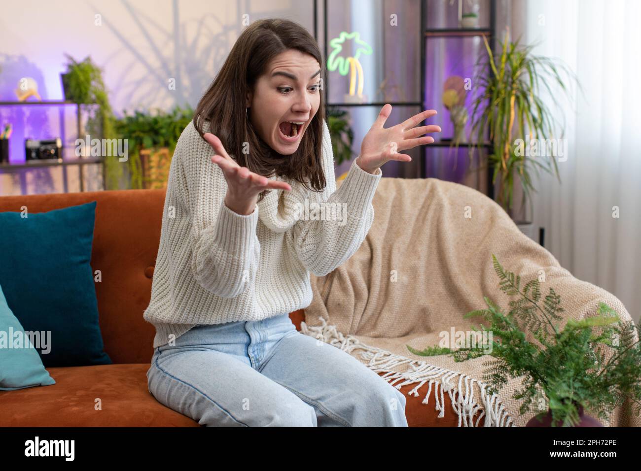 Stressed upset young woman screams from stress tension problems panic ...