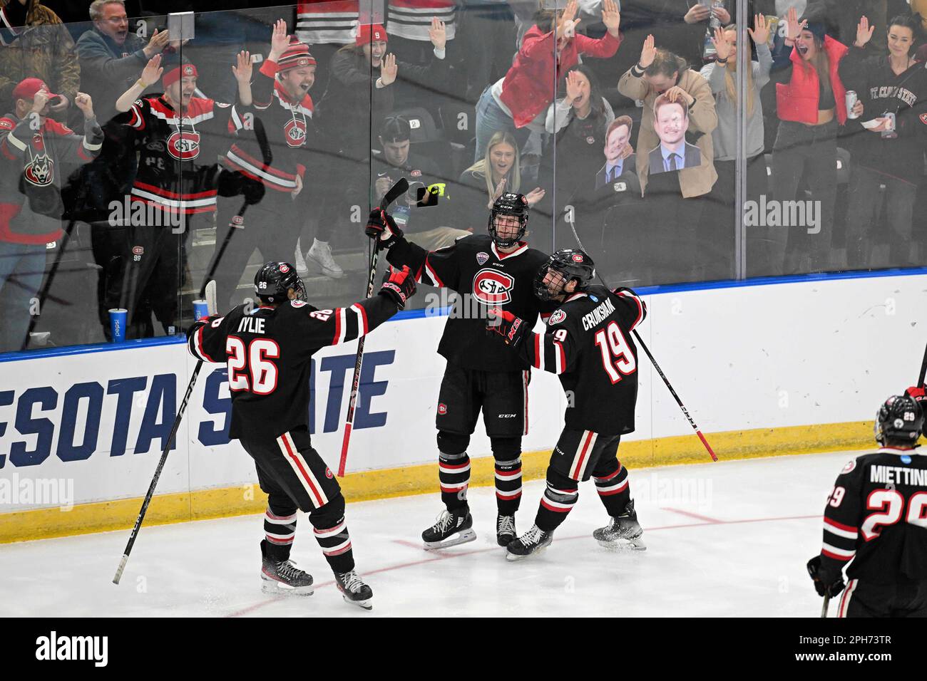 St. Cloud State Huskies forward Adam Ingram (34) (center) is ...