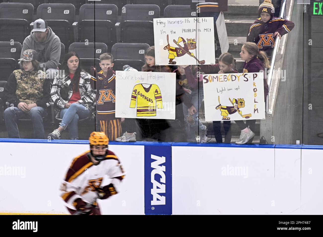 Fargo, USA. 25th Mar, 2023. Minnesota Gopher fans hold up signs during ...