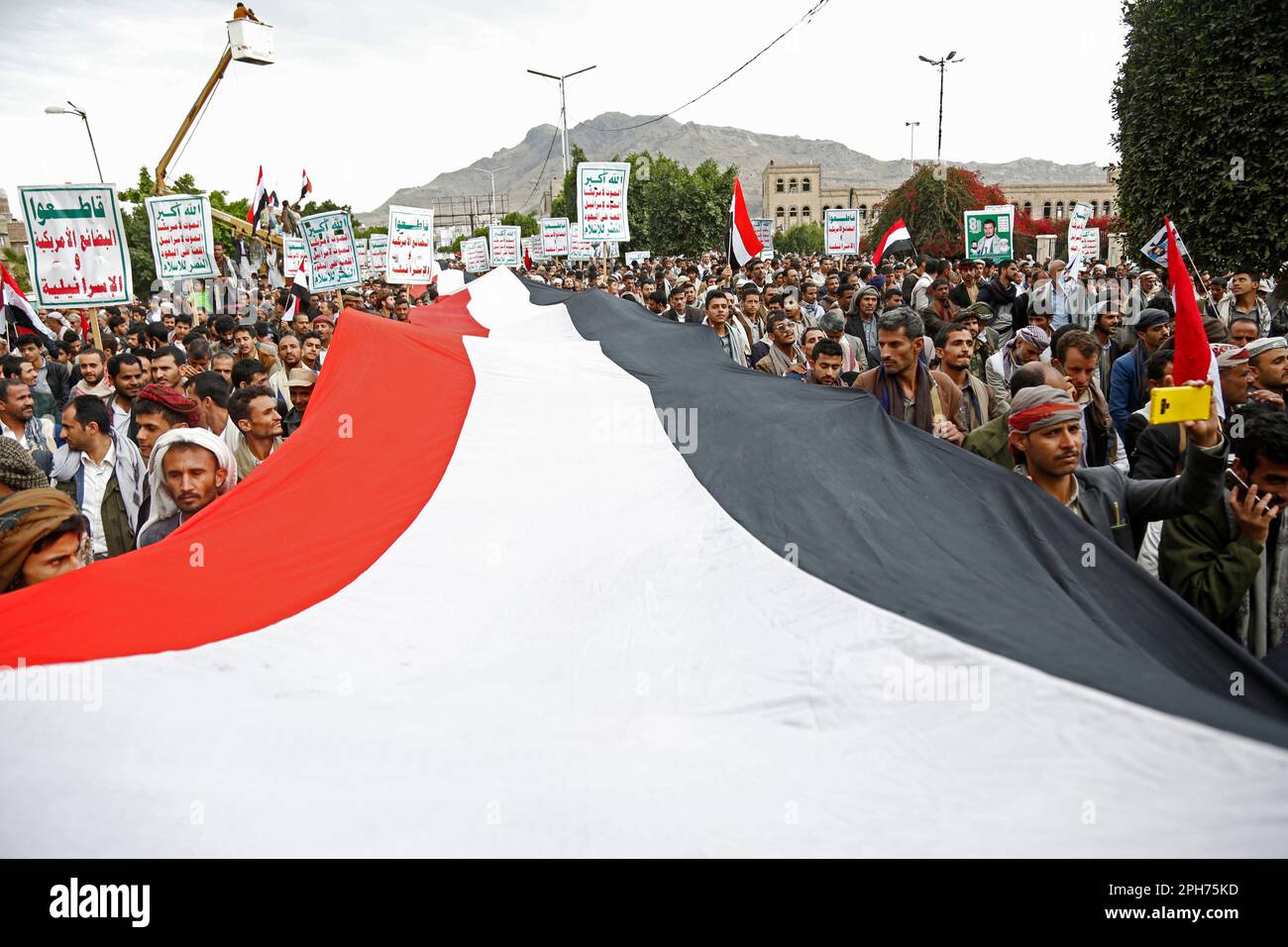 Houthi supporters chant slogans as they attend a rally marking eight ...