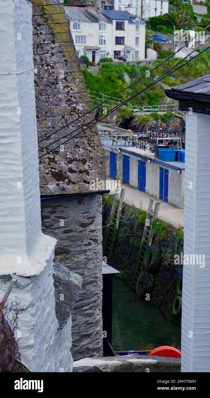 Polperro village, with its narrow, winding streets and traditional ...