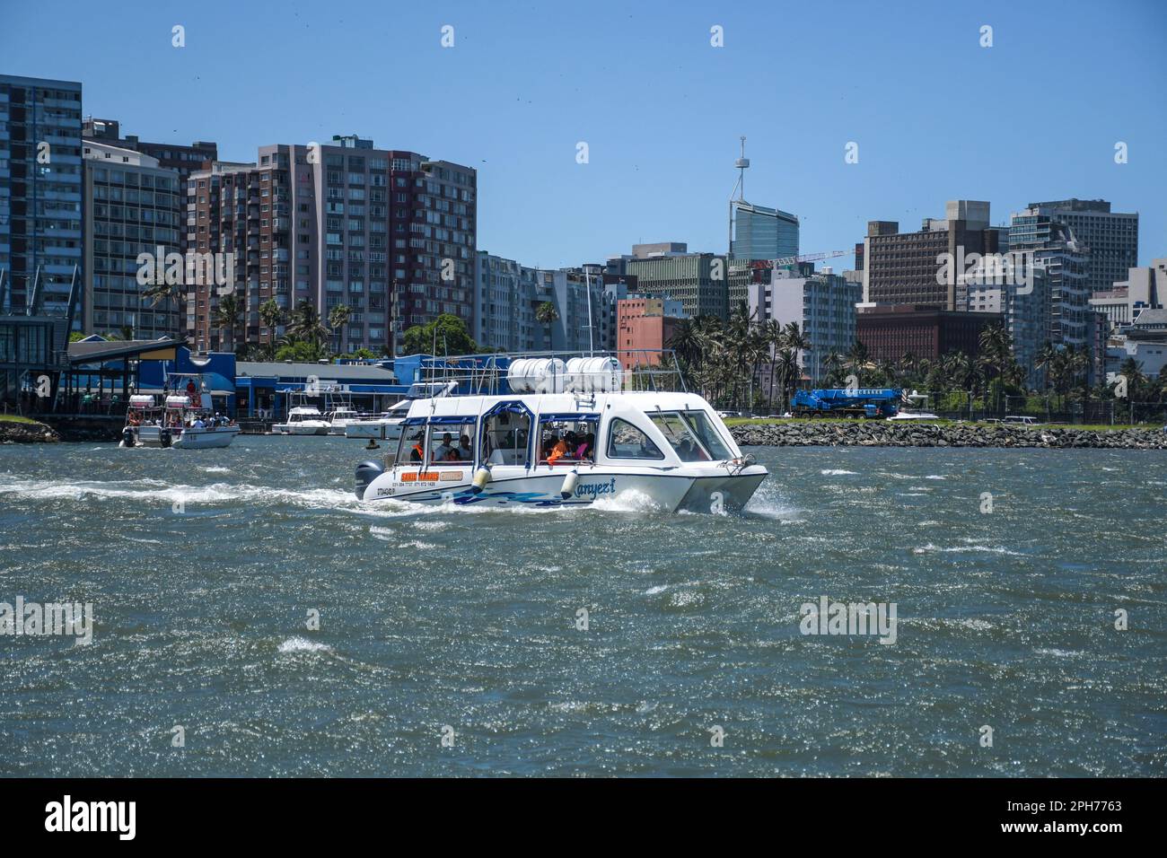 Durban port harbor with cargo ship and tourist boat Indian ocean Stock ...