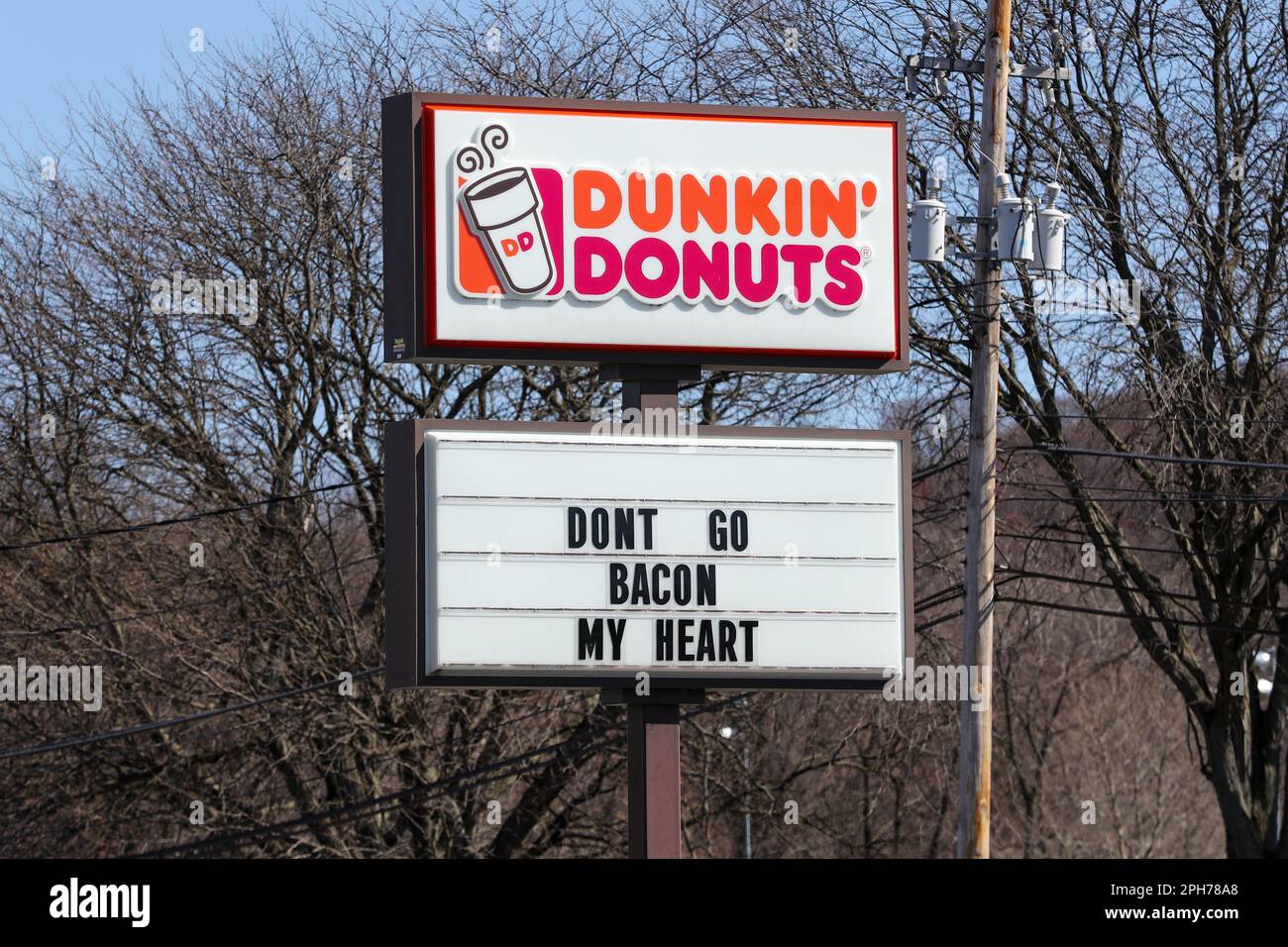 A sign with the Dunkin' Donuts logo is seen at its restaurant along ...