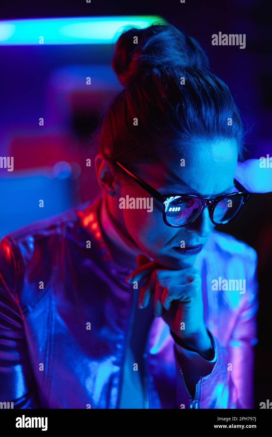 Neon metaverse futuristic concept. pensive modern female in glasses ...