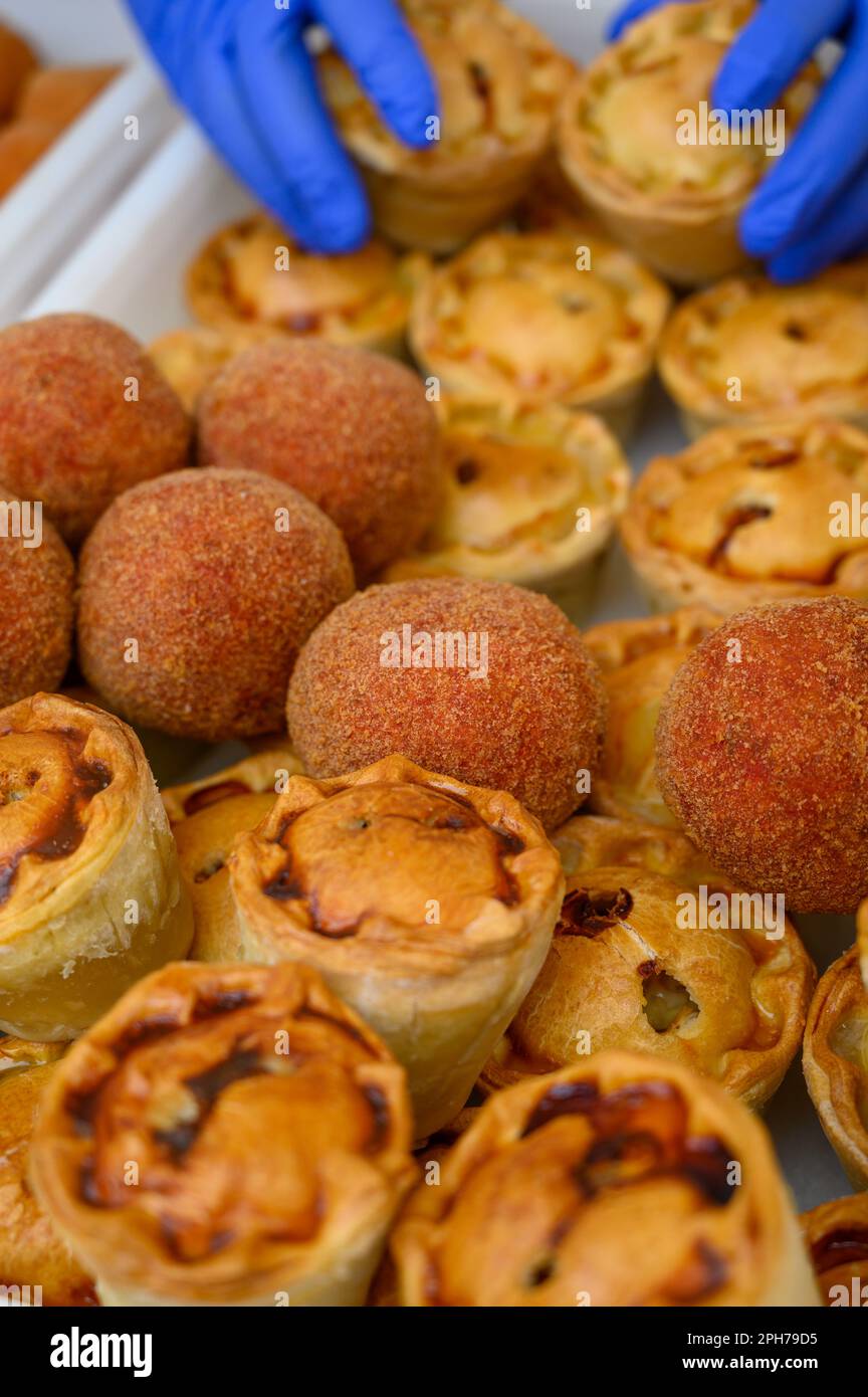 Traditional street food in UK, stuffed fried Scotch eggs with ...