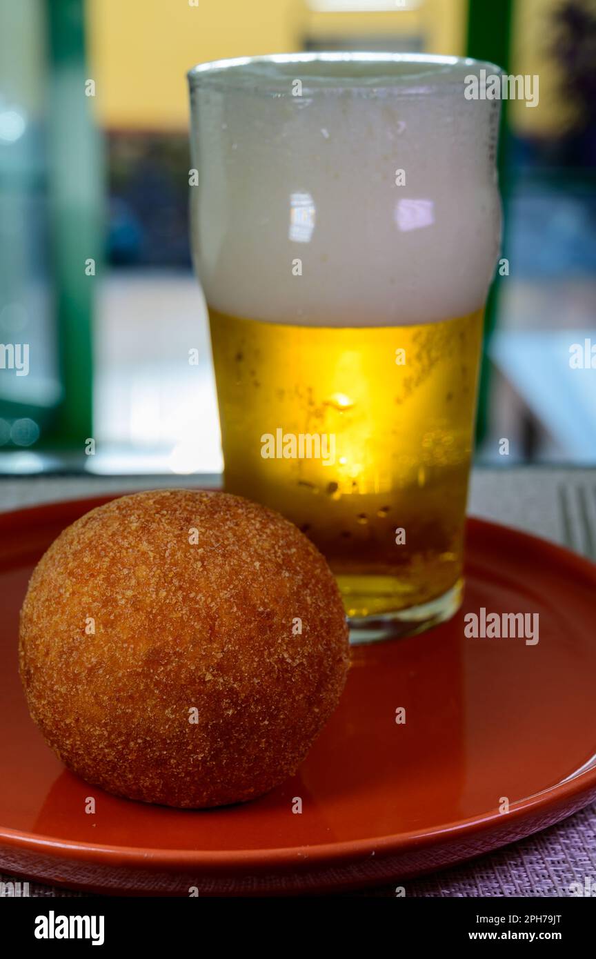 Traditional street food in Scotland, glass of fresh lager beer and ...