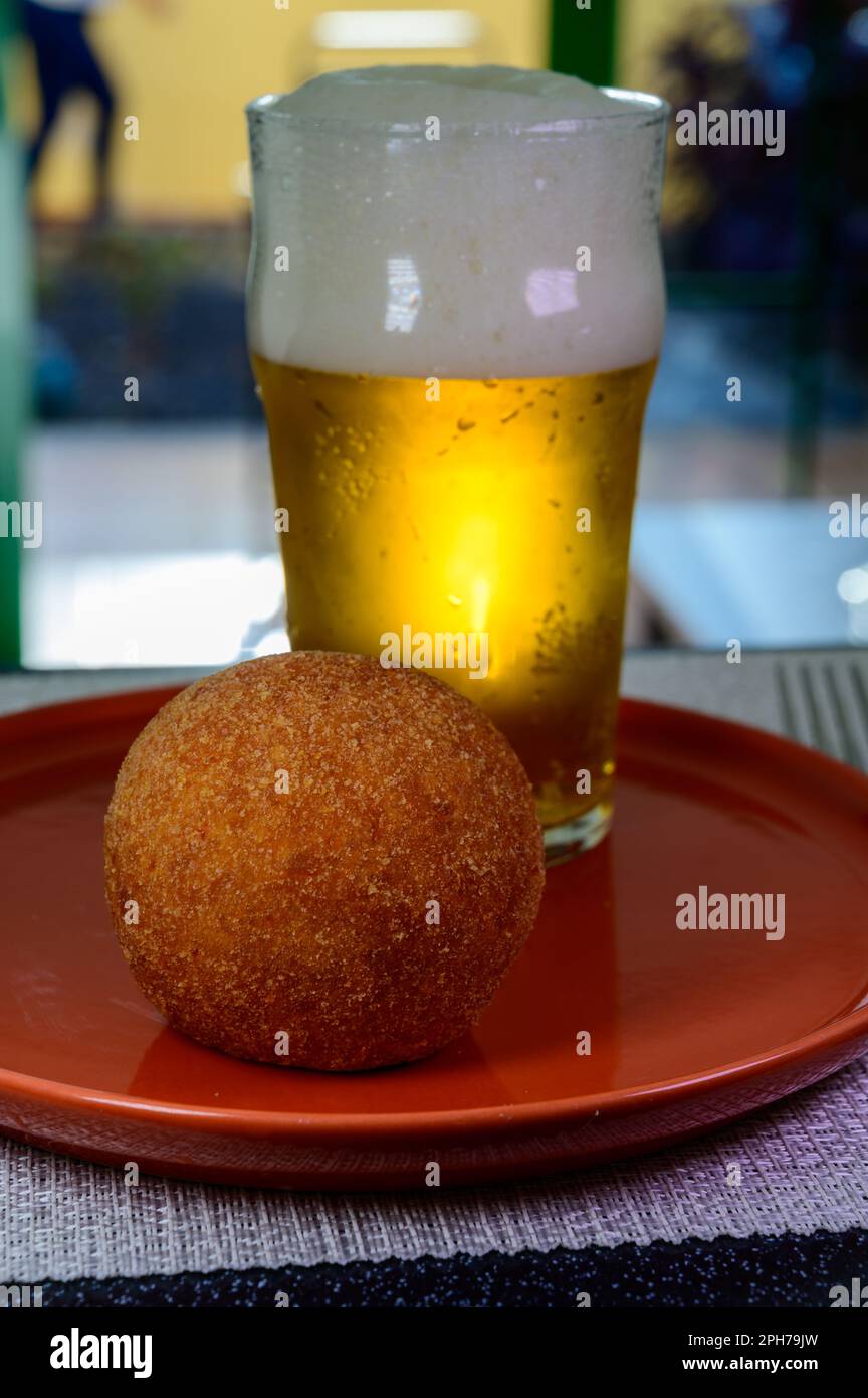 Traditional street food in Scotland, glass of fresh lager beer and ...