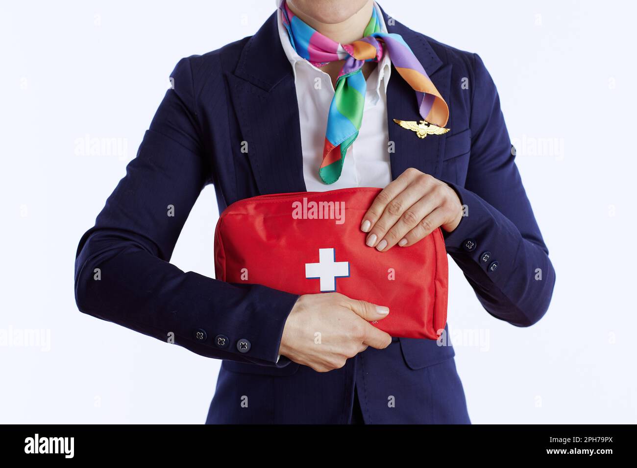 Closeup on stylish flight attendant woman against white background in ...