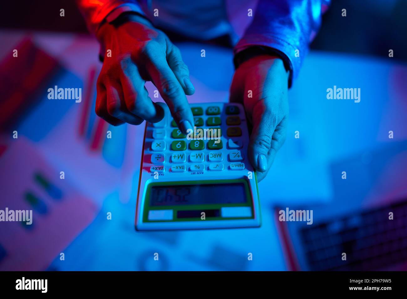 Closeup on modern female with calculator Stock Photo - Alamy