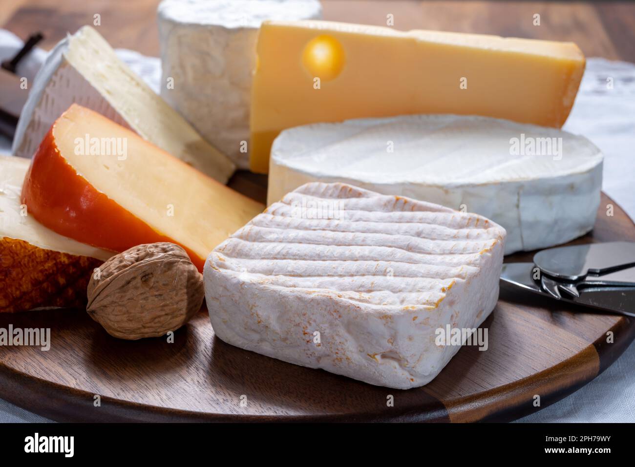Collection of Belgian cheeses, soft yellow cow milk cheese with white ...