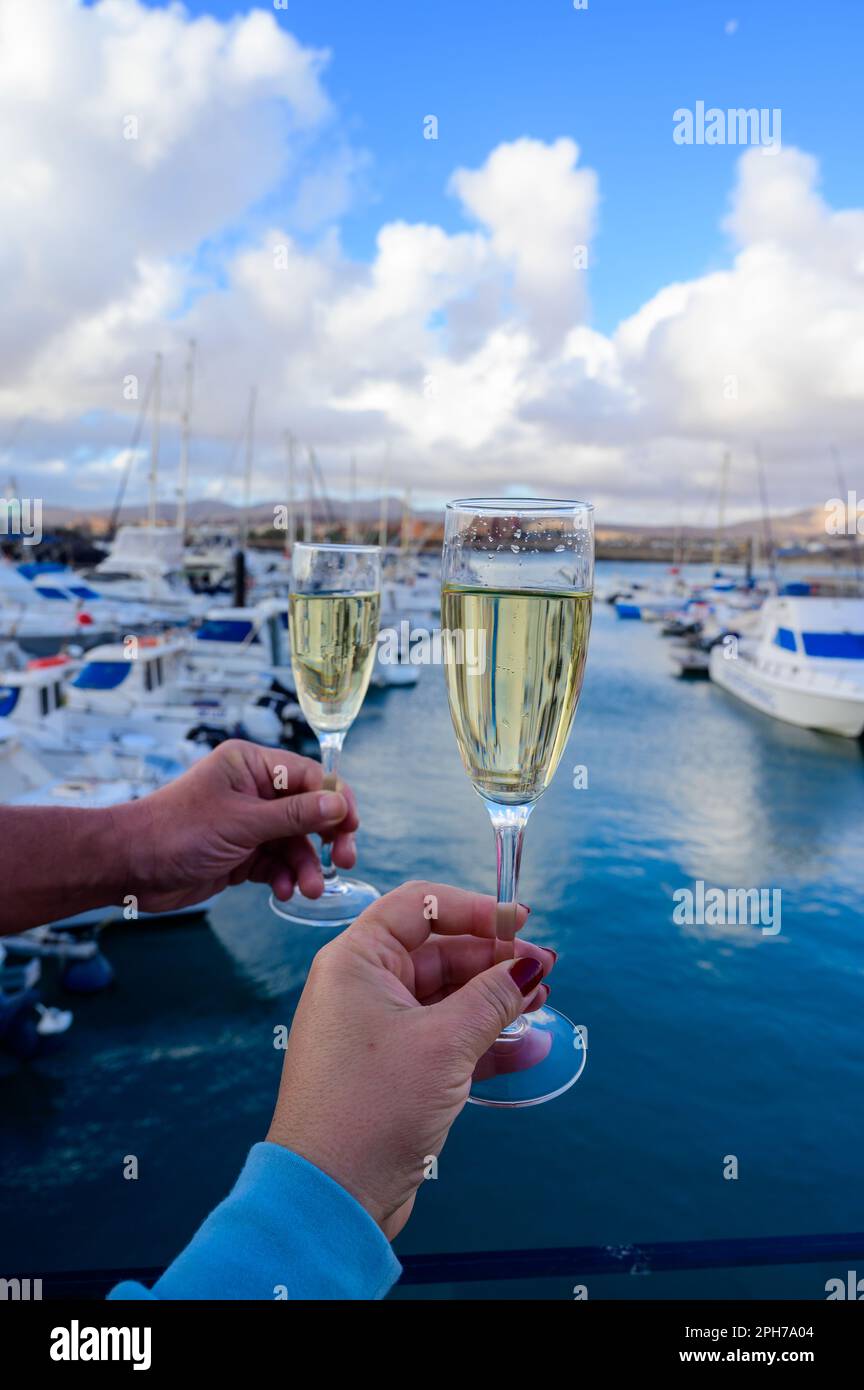 Everyday party, hands with glasses of cava or champagne sparkling wine ...