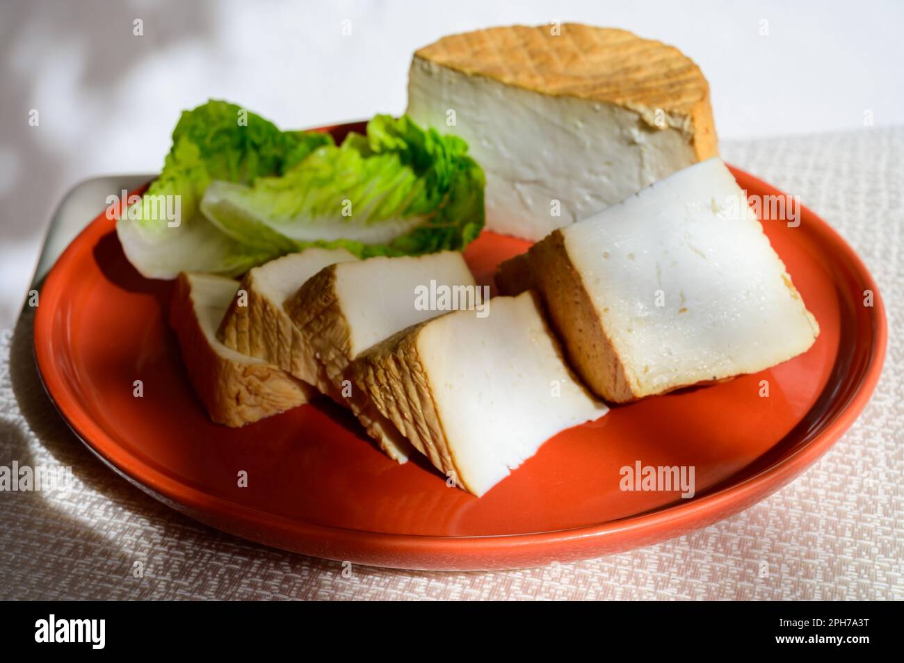 Cheese collection, piece of fresh smoked Spanish goat cheese close up ...
