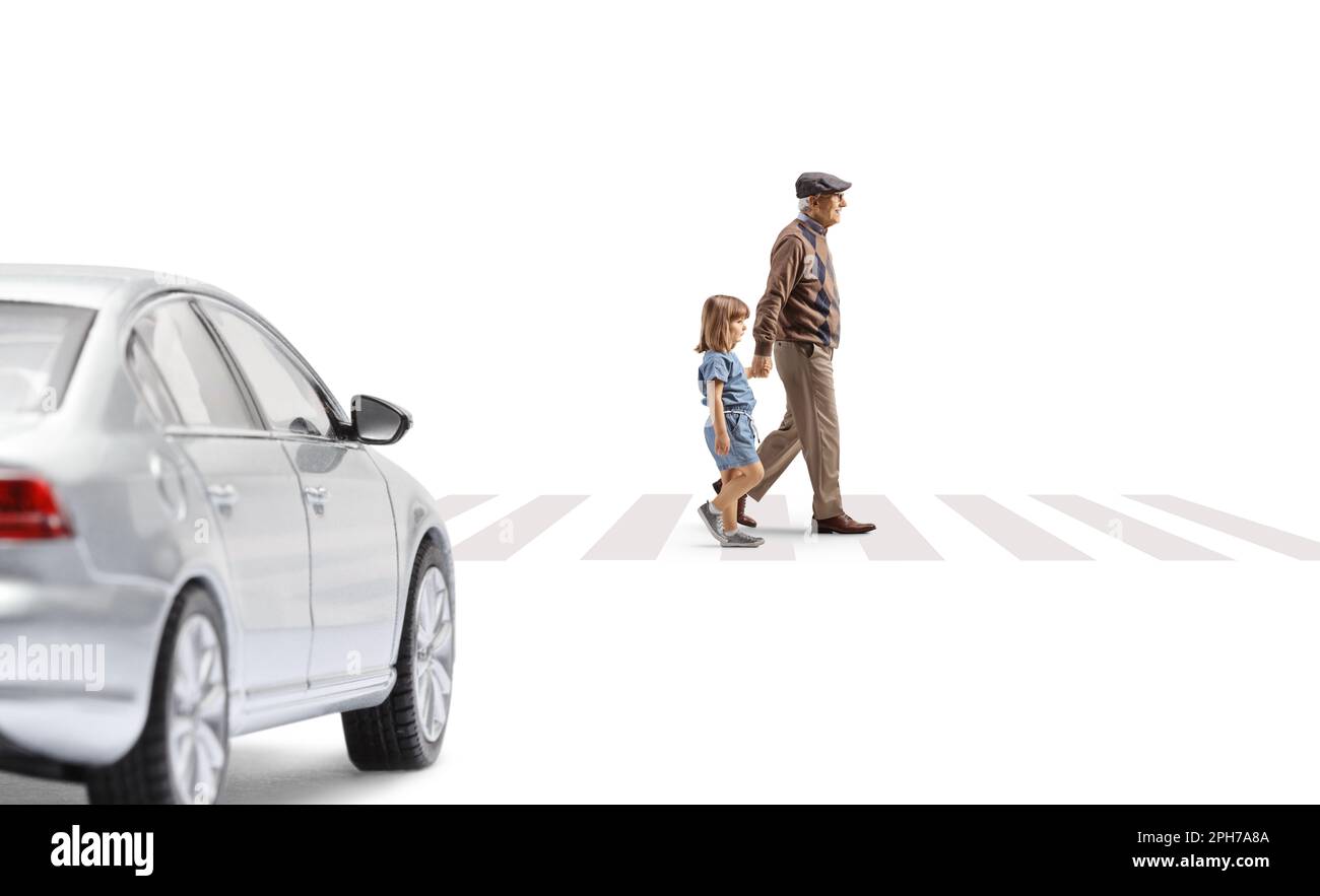 Full length profile shot of a grandfather crossing street with a child ...