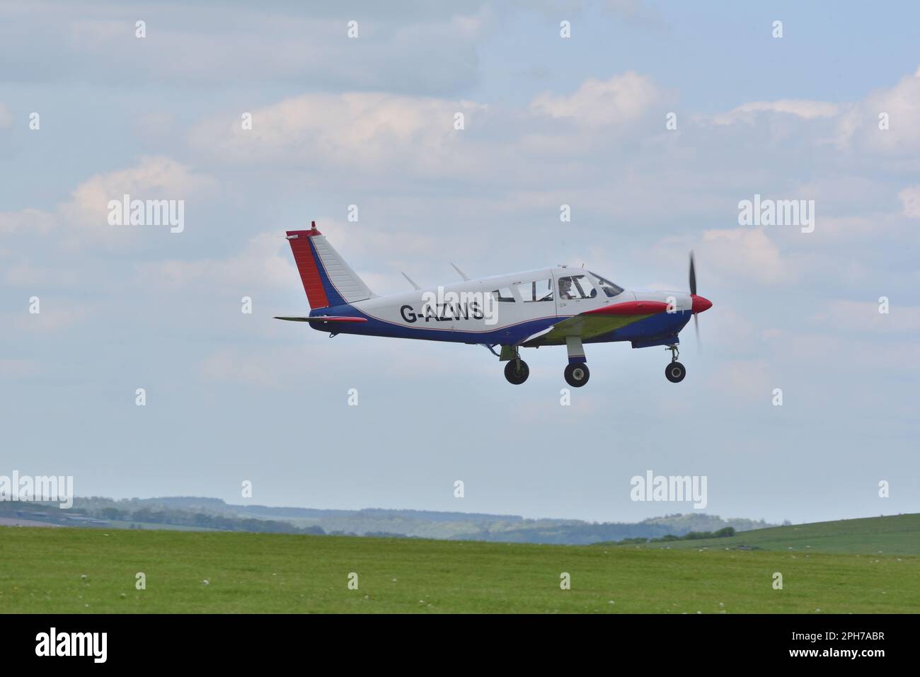 A Piper PA-28R Cherokee Arrow 180, registered G-AZWS, takes off from ...
