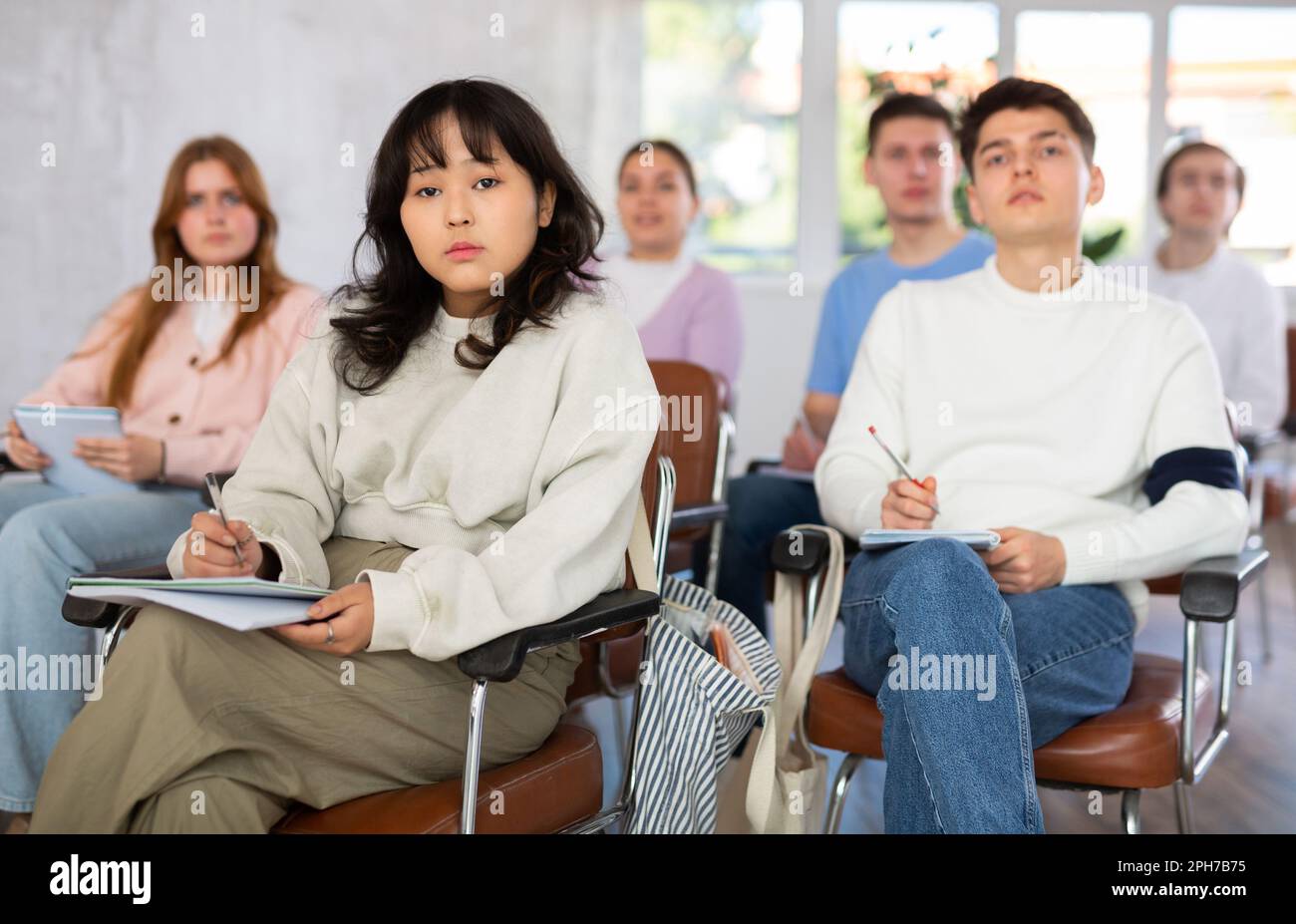 Group of high school students listening to lecture in auditorium Stock ...