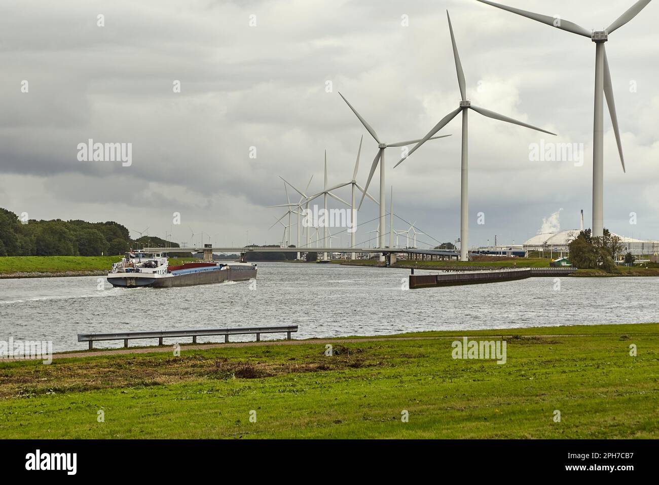 Wind tubines along the waterside Stock Photo - Alamy