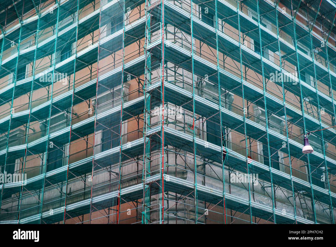 Scaffolding on the facade of a tall building Stock Photo - Alamy