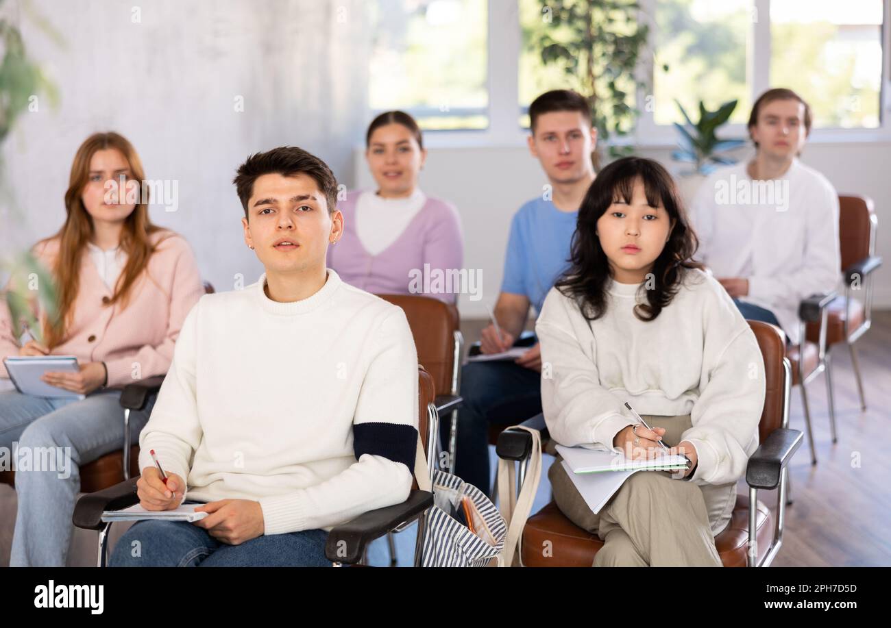Group of high school students listening to lecture in auditorium Stock ...
