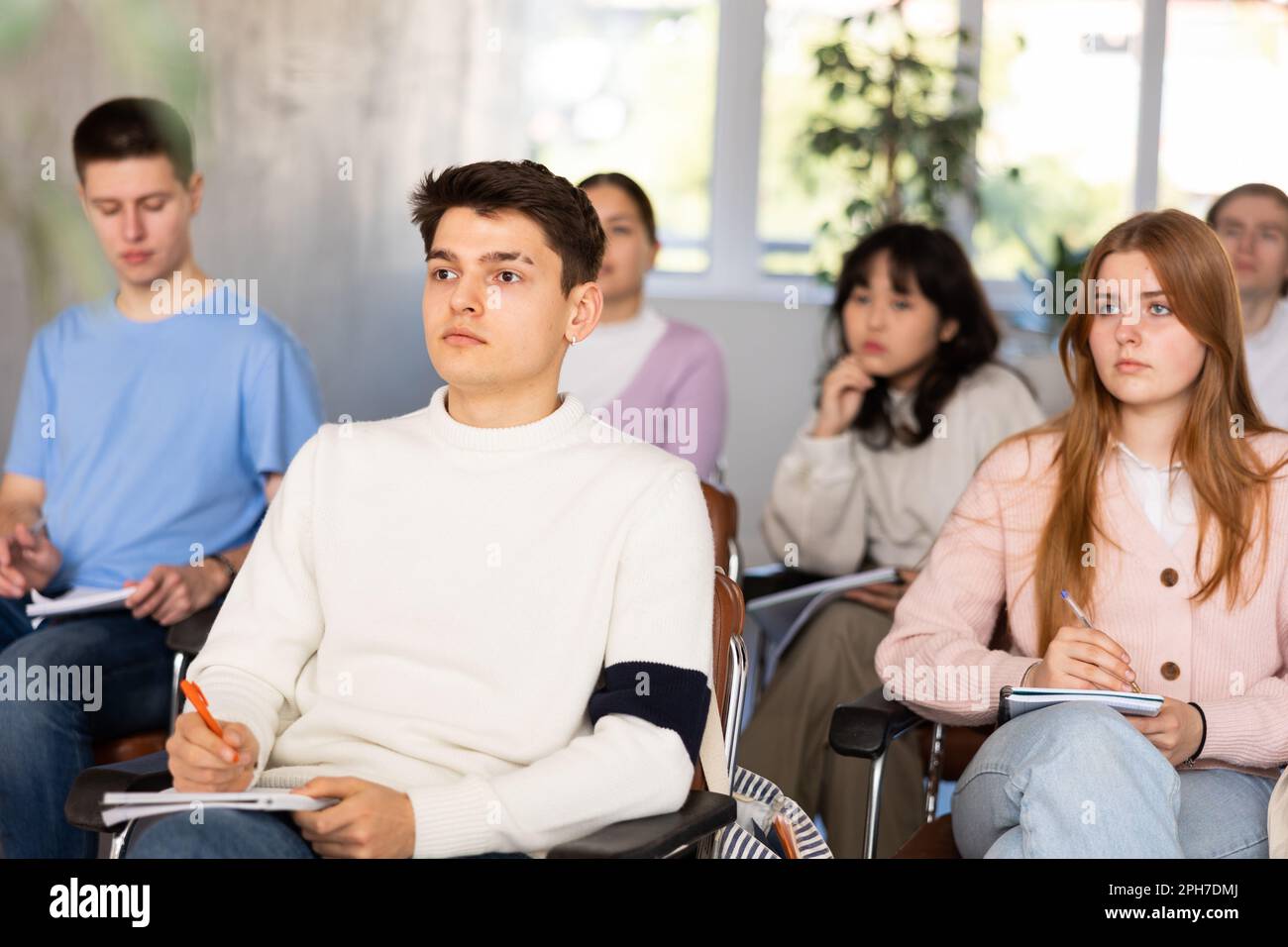 Group of high school students listening to lecture in auditorium Stock ...