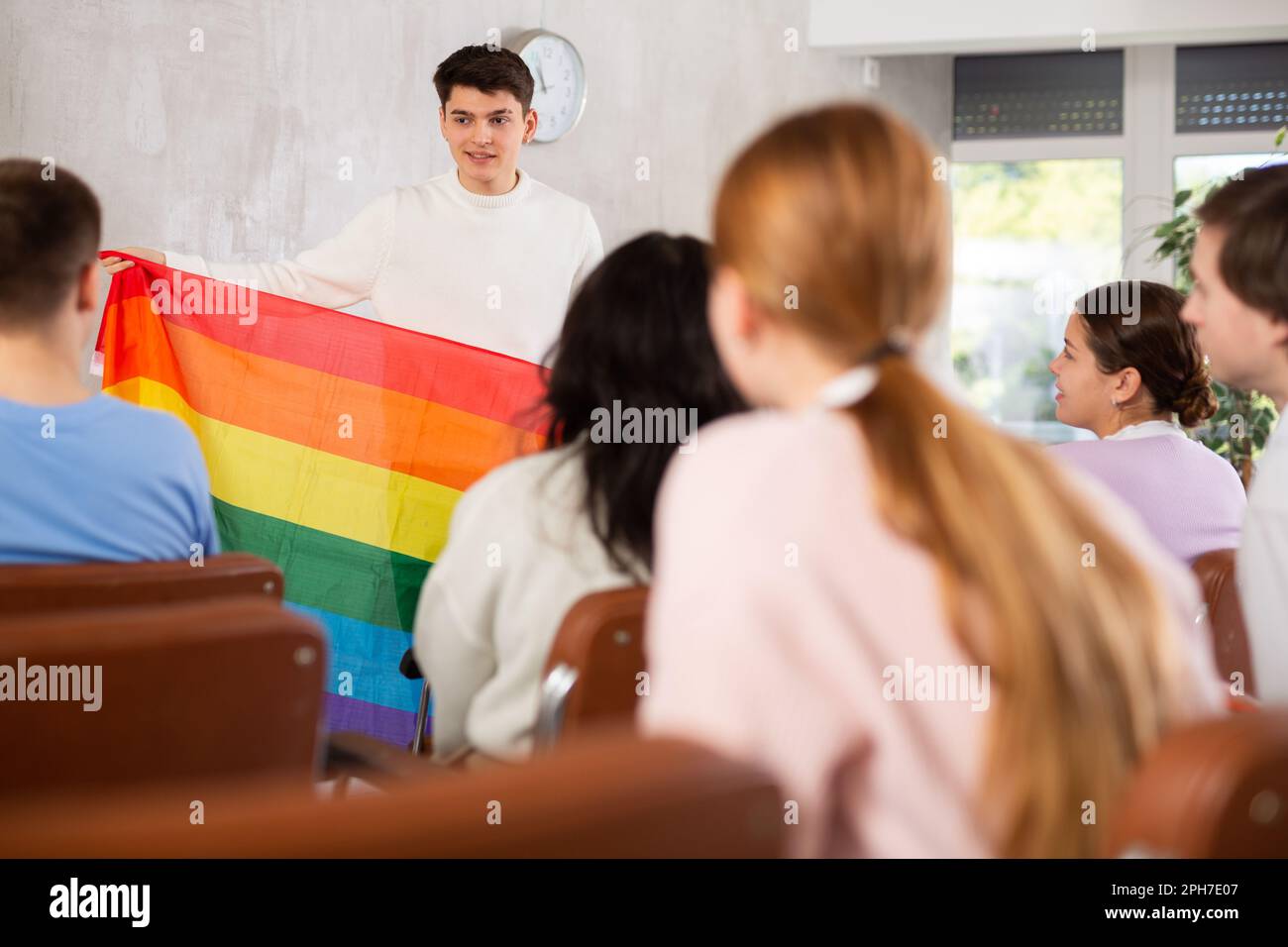 Student tells his fellow students the essence of LGBT holding rainbow ...