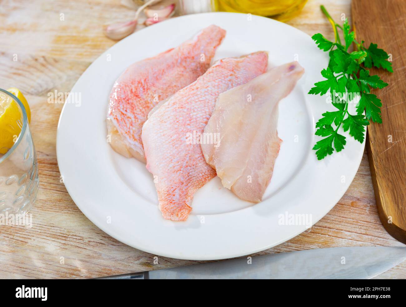 Fresh raw fillet of sea bass Stock Photo - Alamy