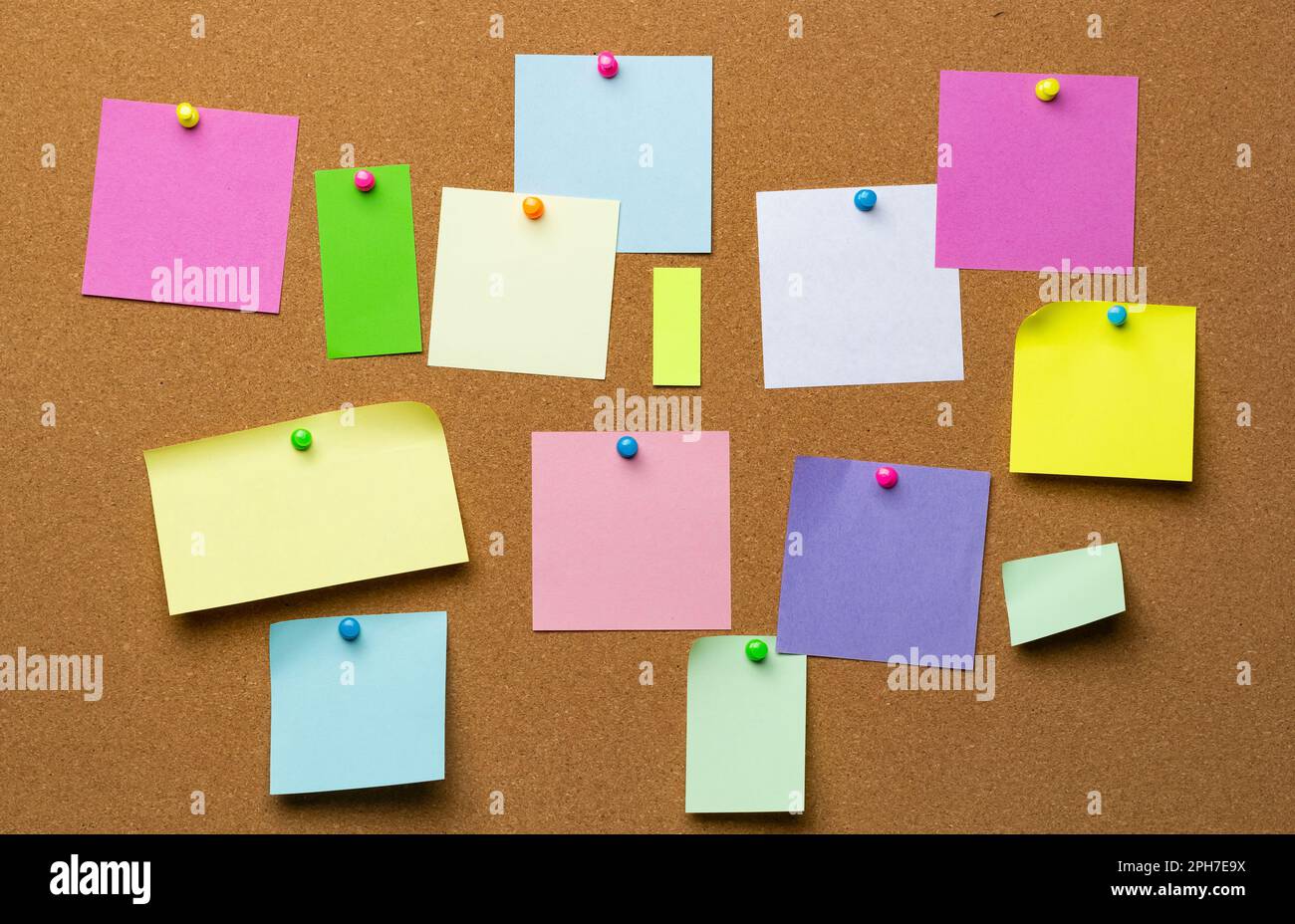 Post blank stickers on cork bulletin board. Concept of business notes ...