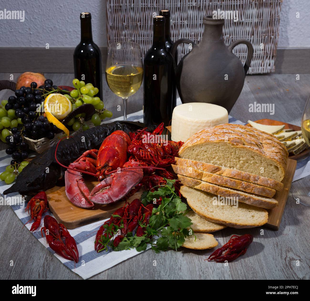 Still life with cooking marine products, wine and cheese Stock Photo ...