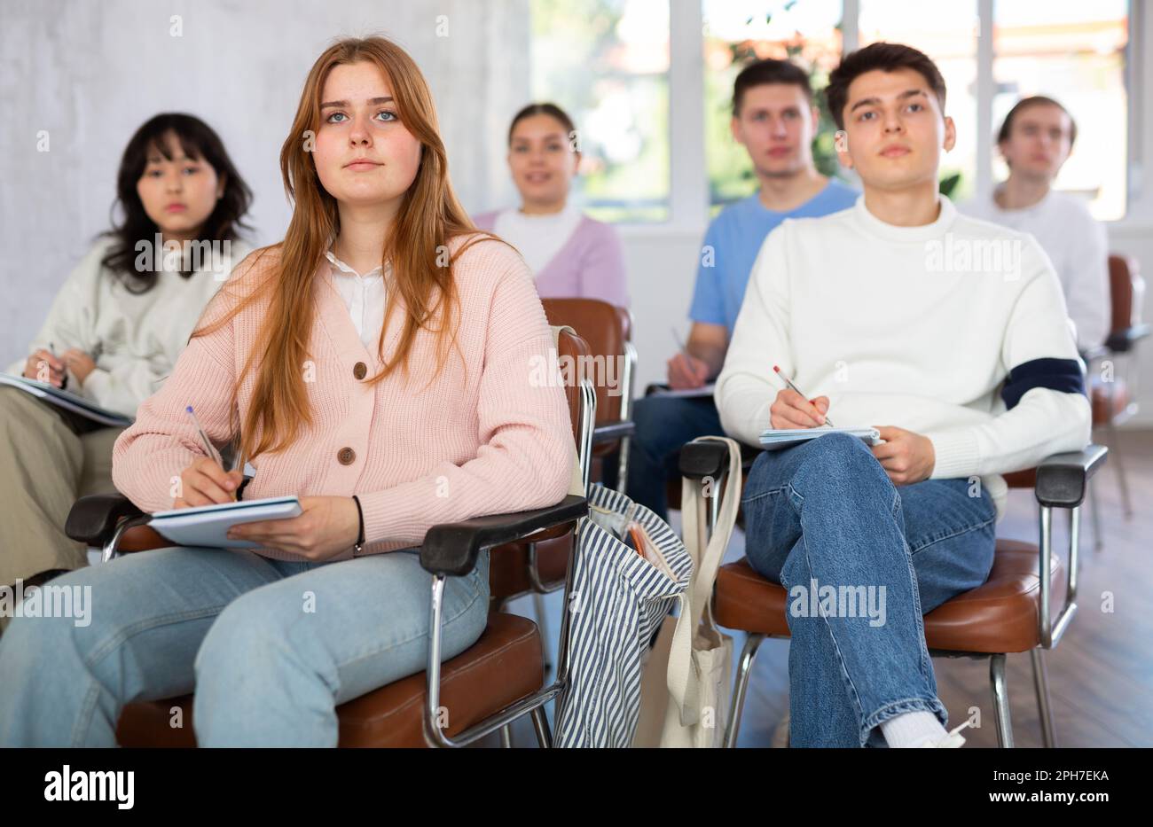Group of high school students listening to lecture in auditorium Stock ...