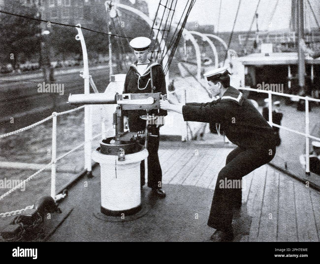 Royal Navy sailors with a deck mounted maxim machine gun on the ...