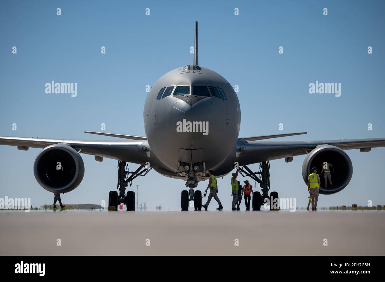 Italian and American forces conduct a post-flight check on an Italian ...