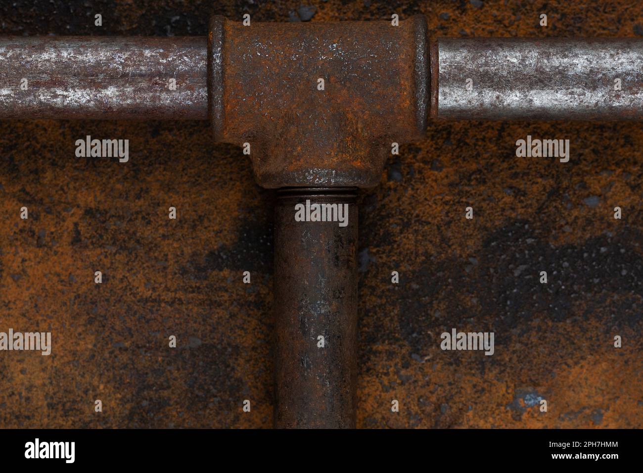 Old rusty valve pipes on rusty metal wall background Stock Photo - Alamy