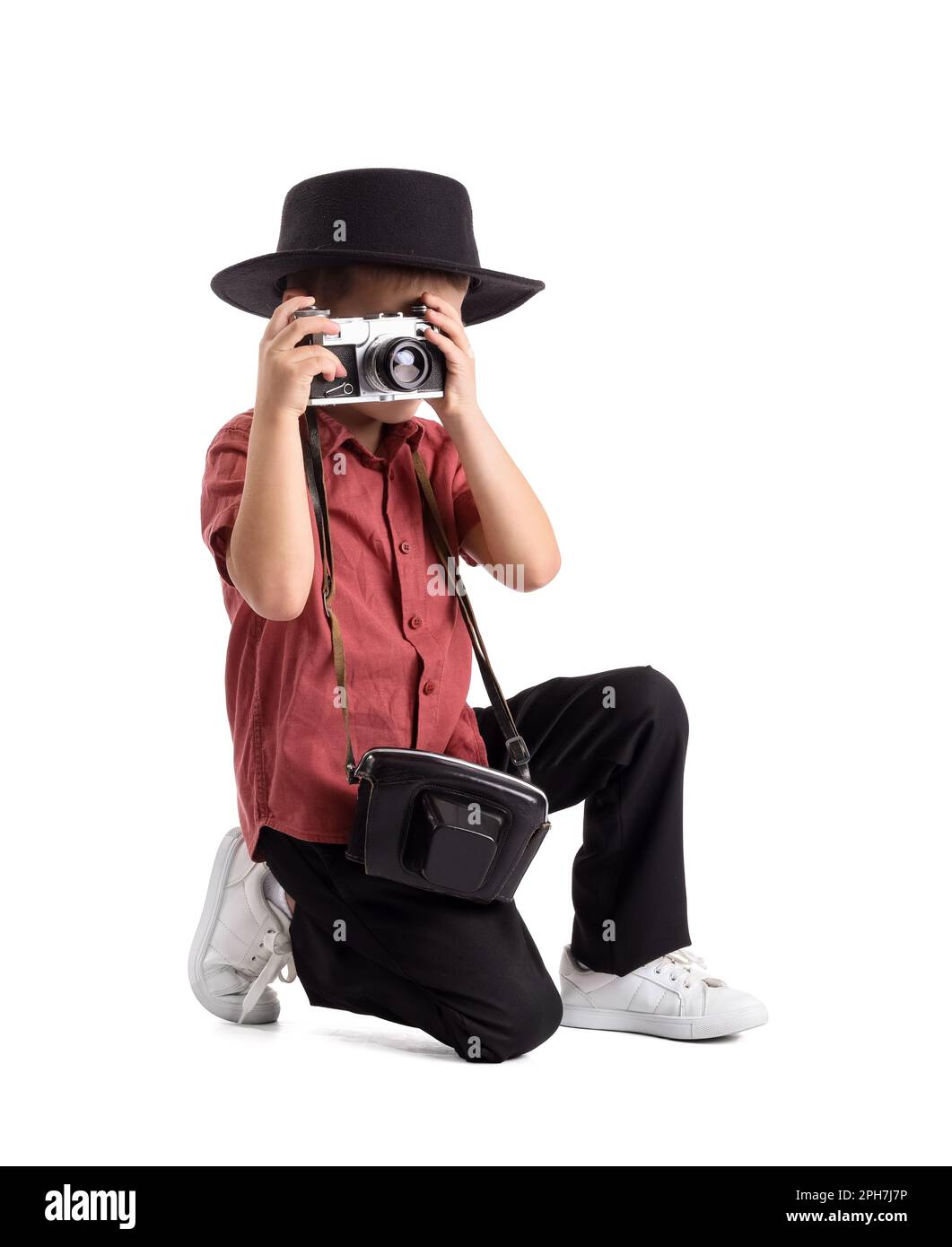 Cute little photographer with camera on white background Stock Photo ...