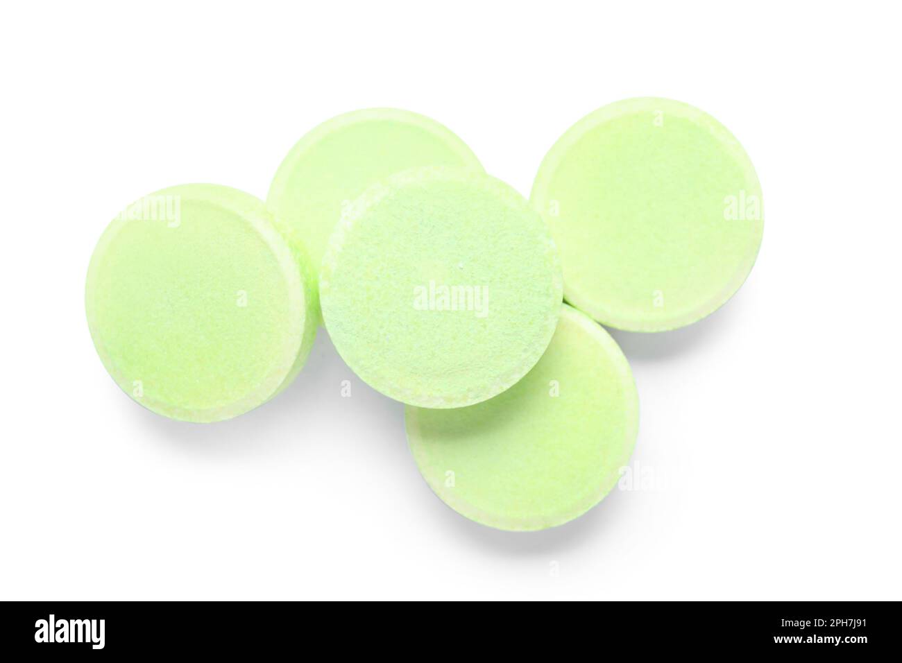 Green soluble tablets isolated on white background Stock Photo - Alamy
